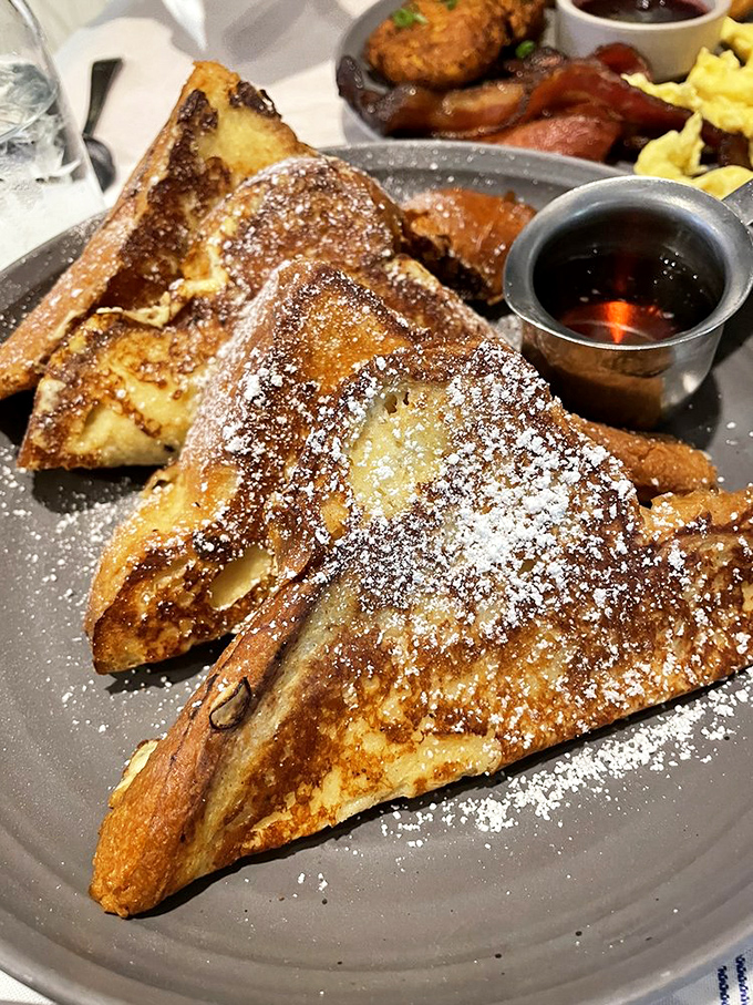 French toast that makes you question why you ever settled for lesser breakfast options. Powdered sugar snowfall included.
