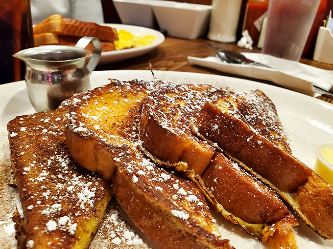 French toast so thick and golden, it could double as a doorstop if it wasn't so deliciously destined for your fork.