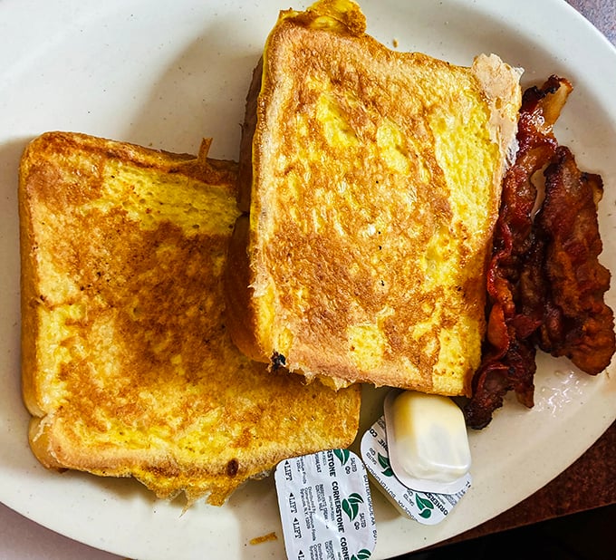 French toast that puts fancy brunch spots to shame, with perfectly crisp edges and a side of bacon that means business.