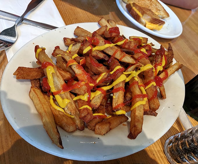 These aren't just fries&mdash;they're golden potato masterpieces, crispy on the outside, fluffy inside, with ketchup and mustard artfully applied.