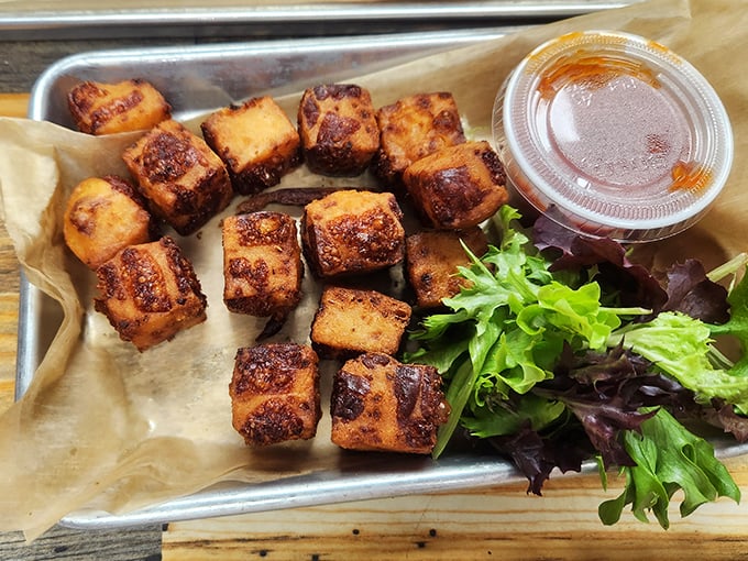 These aren't just any cheese curds&mdash;they're golden-brown nuggets of joy with a side of greens for those who need to pretend they're eating healthy.