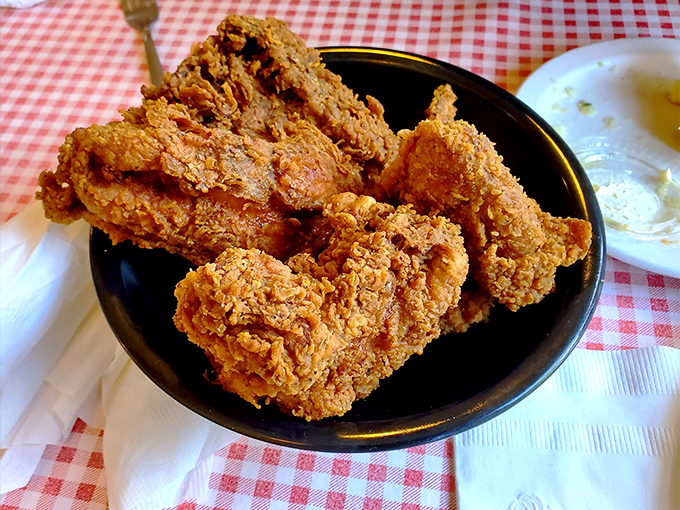 Fried chicken that cracks like a textbook opening, revealing juicy meat that makes you wonder why you ever bothered with fast food versions.