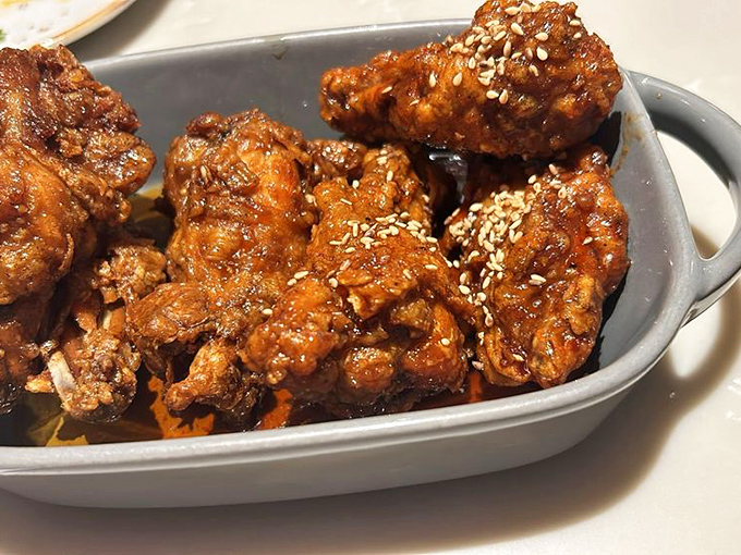 These Korean fried chicken wings aren't just crispy &ndash; they've achieved that mythical texture that makes you wonder if they attended a special chicken finishing school.