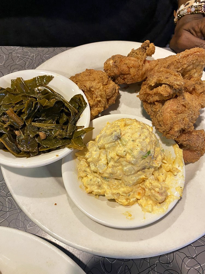 Southern comfort meets Philly attitude in this fried chicken platter with collard greens and scrambled eggs.