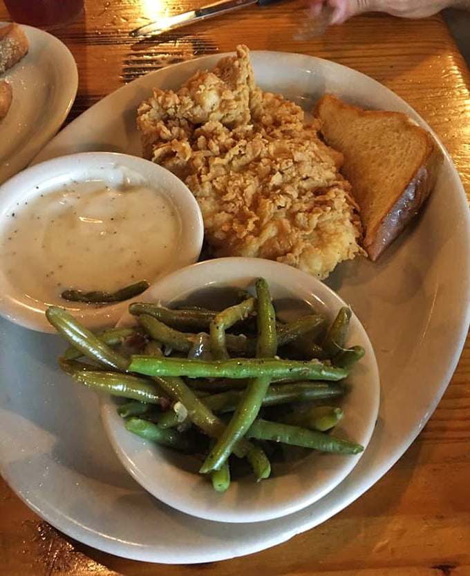 Comfort on a plate: golden-fried chicken with a crunch you can hear across the room, alongside green beans that didn't come from a can.