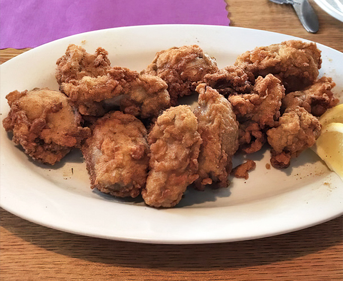 Fried oysters that could convert non-believers&mdash;crispy armor protecting briny jewels within. The lemon wedge isn't a suggestion; it's the perfect finishing touch.