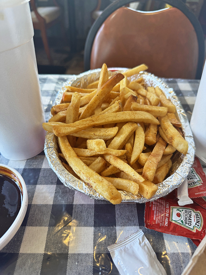 French fries that understand their supporting role but still show up ready to perform alongside the barbecue stars.