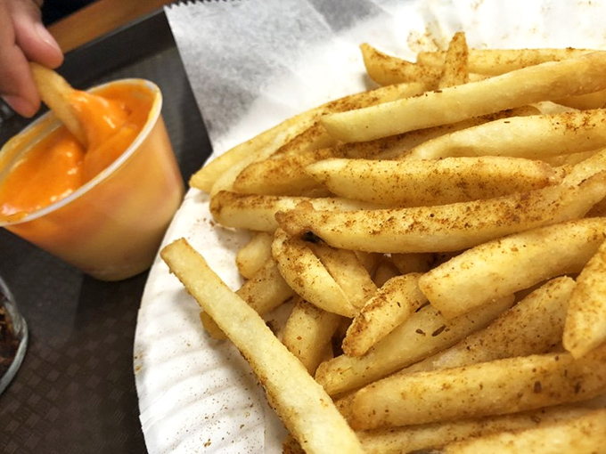 These golden fries dusted with seasoning aren't just a side&mdash;they're a dippable delivery system for that glorious cheese sauce.
