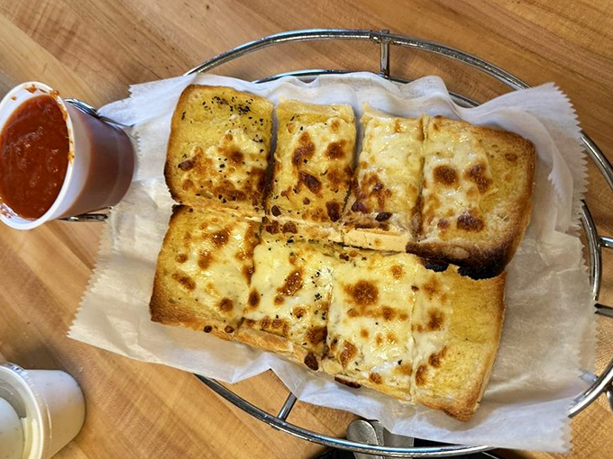Garlic bread that's having an identity crisis as cheesy pizza crust – and we're absolutely here for this delicious confusion.