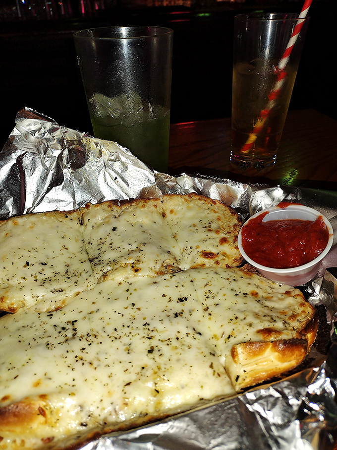 Garlic bread that could ward off vampires from three counties away, yet you'll still lean in for another heavenly bite.