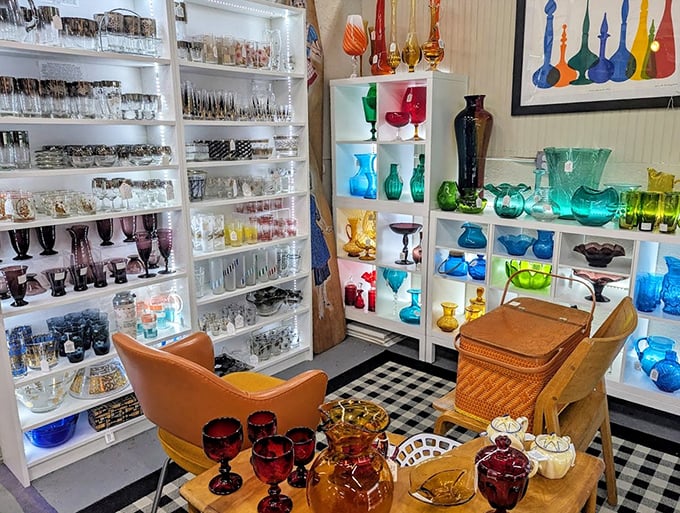 The colorful glass collection creates a kaleidoscope effect that would make even the most minimalist decorator think, "Maybe I do need vintage glassware in every hue."