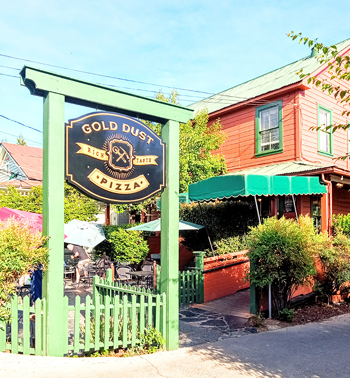 Gold Dust Pizza's garden patio beckons with the promise of wood-fired delights&mdash;the green picket fence is just the first hint of the charm awaiting inside.