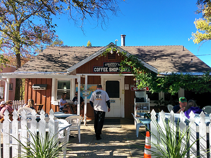 Granny's Coffee Shop, with its white picket fence and rustic charm, looks like it was designed by Norman Rockwell after his third espresso.