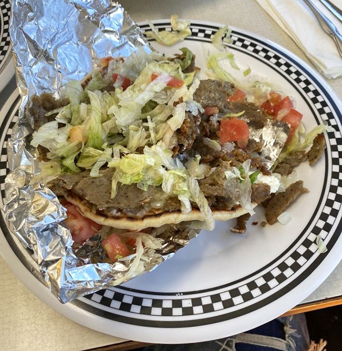 The gyro plate arrives like a deconstructed masterpiece&mdash;seasoned meat, fresh vegetables, and warm pita creating the holy trinity of Greek street food.