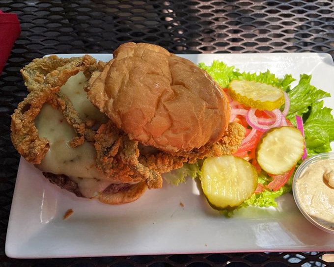 This burger doesn't just come with cheese &ndash; it surrenders to it completely, with a golden blanket that's worth every napkin you'll need.