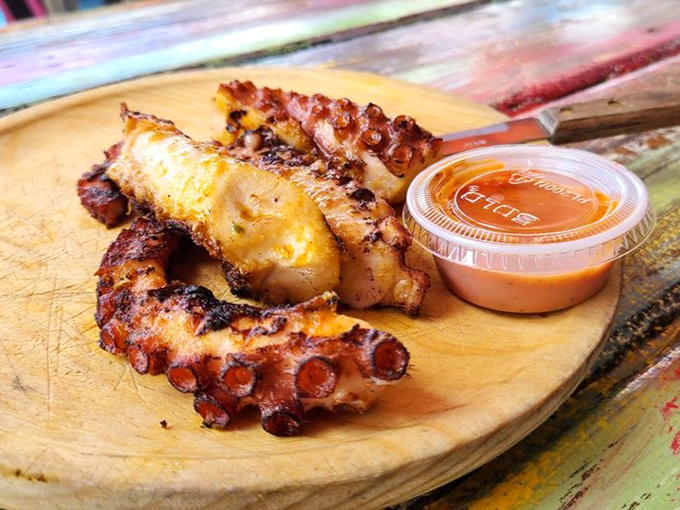 Octopus that's had a perfect tan on the grill. These tentacles have gone from mysterious sea creature to the star of your lunch memories.
