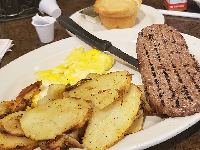 Breakfast of champions: golden home fries, fluffy scrambled eggs, and a perfectly grilled sirloin that makes morning meetings worth attending.