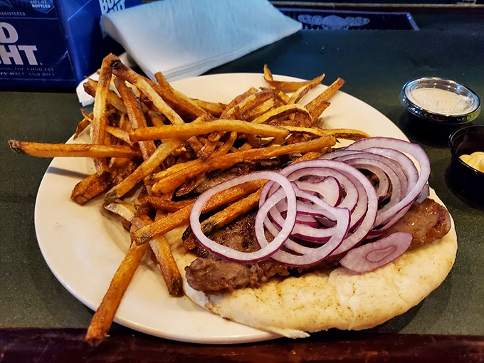 This open-faced sandwich isn't just a meal, it's an architectural achievement of meat, bread, and toppings that demands respect.