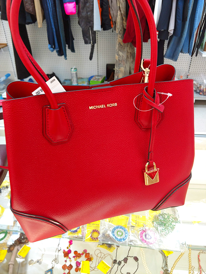 That red Michael Kors bag isn't just arm candy&mdash;it's proof that luxury and thrift can coexist beautifully in the same shopping cart.