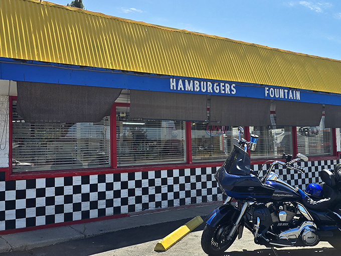 Harold's Frosty, with its checkerboard trim and "HAMBURGERS FOUNTAIN" sign, promises the kind of milkshake that requires both a straw and spoon.