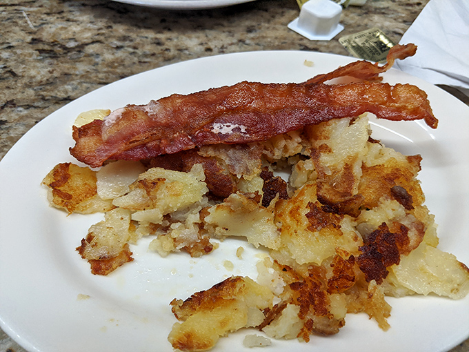 These hash browns with bacon aren't just crispy potatoes&mdash;they're the golden foundation of a perfect morning, with edges so crisp they practically sing.