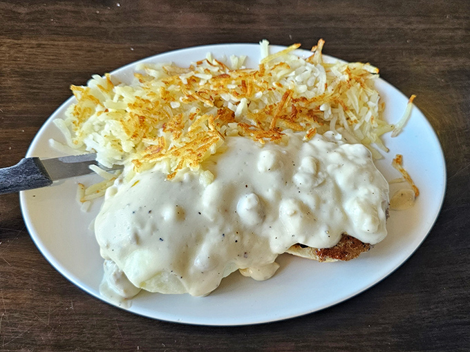 Country-fried steak under a blanket of peppery gravy, with hashbrowns crisped to golden perfection. Comfort food that hugs you from the inside.
