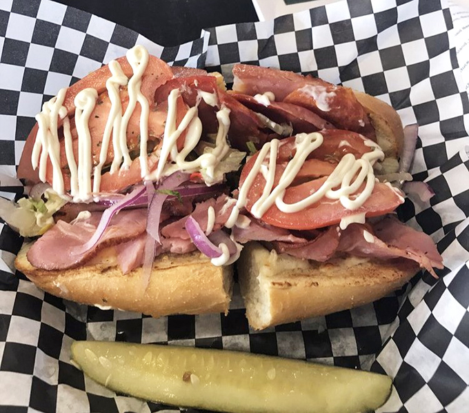 This isn't just a sandwich; it's an architectural achievement. Layers of meat and cheese creating the skyscraper of lunch options.