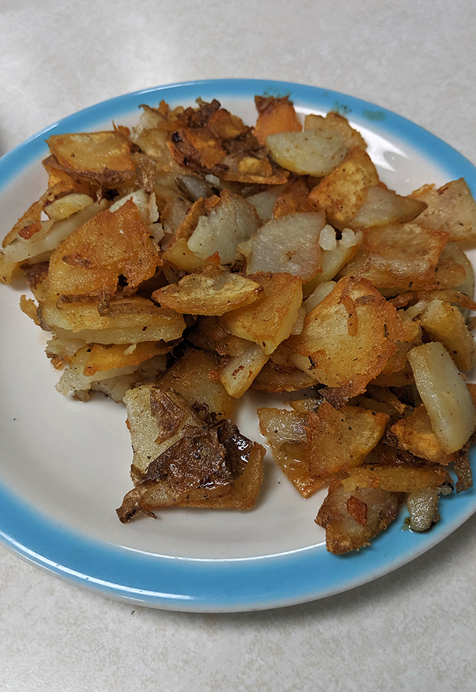 Home fries that have achieved the potato trifecta: crispy edges, tender centers, and just enough seasoning to make you forget ketchup exists.
