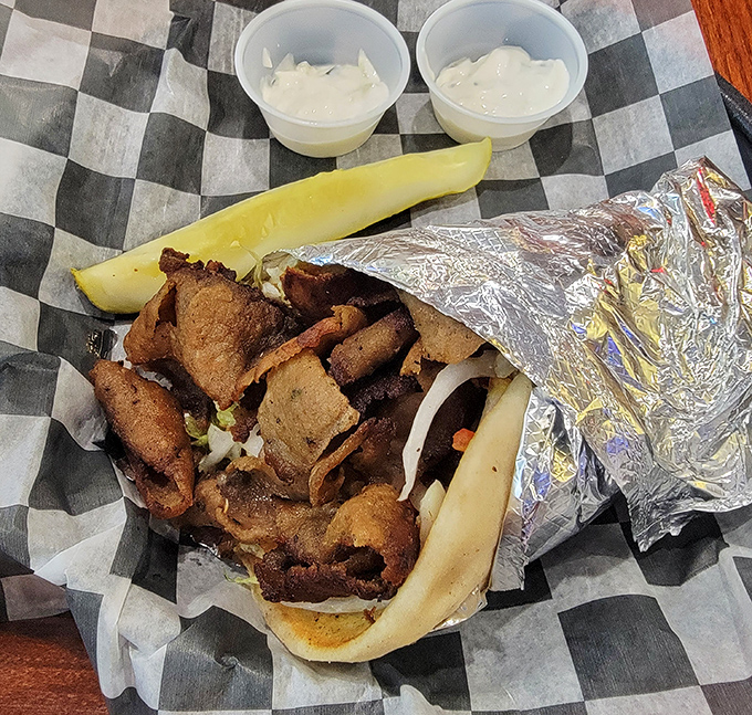 The Homestead Gyro wrapped in foil like the culinary gift it is. Mediterranean flavors meet Pennsylvania portions in this handheld masterpiece.