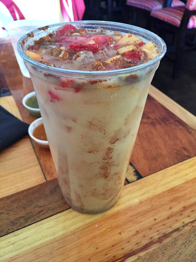 This isn't just horchata&mdash;it's a cinnamon-kissed cloud in a cup, topped with fresh fruit that transforms a simple drink into dessert's cool cousin.