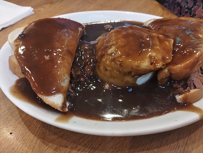 The hot beef sandwich&mdash;where gravy isn't just an addition, it's practically a philosophy. Fork required, napkins essential, afternoon nap highly recommended.