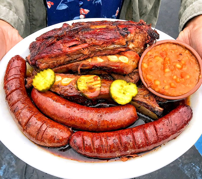 A barbecue sampler that doubles as edible art. Those hot links have the perfect snap that announces: serious smoking happened here.