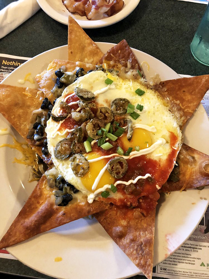 Huevos Rancheros reimagined as an edible star with jalape&ntilde;os, black beans, and a sunny-side-up egg playing the leading role.