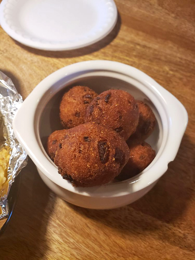 Hush puppies so perfectly golden they deserve their own Florida postcard. These cornmeal spheres of joy are worth every delicious calorie.