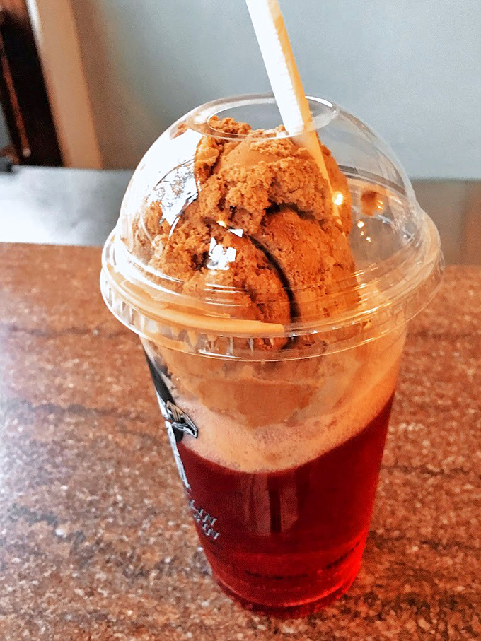The forgotten art of the ice cream soda lives on. That ruby-red base supporting a chocolate island is what soda jerks have been perfecting for generations.