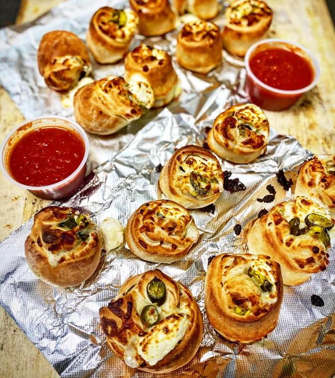 These jalape&ntilde;o poppers look like they're having more fun than anyone at the party &ndash; golden, bubbly, and just waiting to surprise you.