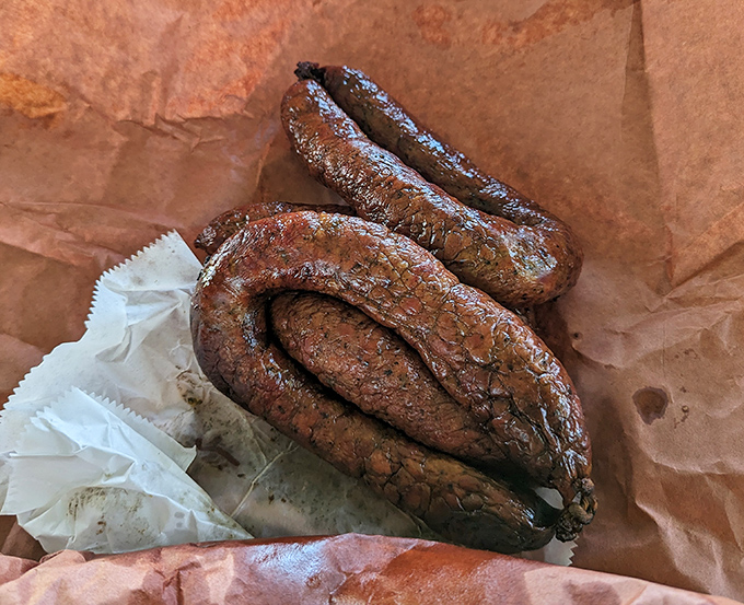 Sausage with a snap that echoes across Texas &ndash; coarsely ground, perfectly seasoned, and curved like a smile on a barbecue lover's face.
