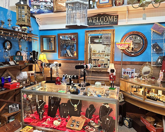This jewelry display transforms ordinary glass cases into treasure chests. Against that striking blue wall, even costume pieces look museum-worthy.