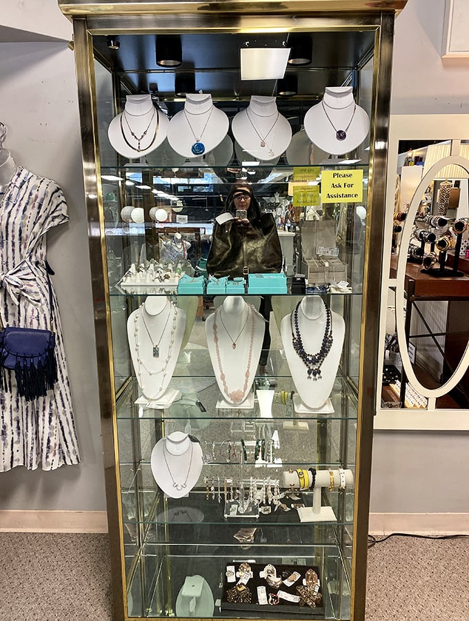 Jewelry that tells stories! Each necklace displayed in this elegant case once adorned someone special&mdash;now waiting for its next chapter with you.