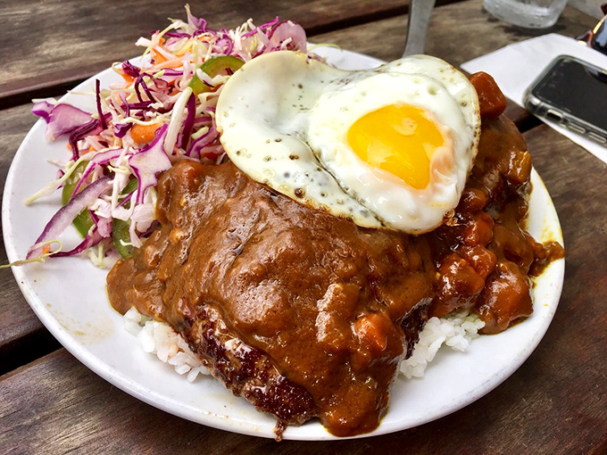 Comfort food nirvana: curry-drenched hamburger steak topped with a sunny-side-up egg that's just waiting to ooze over everything.