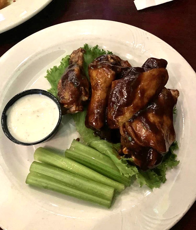 These wings aren't just cooked; they're transformed—glazed with Kentucky bourbon sauce that makes you wonder why you'd ever settle for ordinary buffalo again.