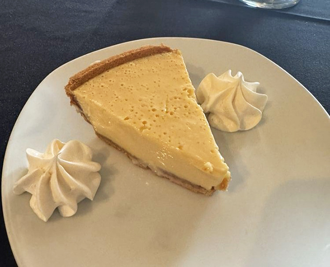 Key lime pie that strikes the perfect sweet-tart balance. Florida's official dessert done right, with those adorable whipped cream rosettes standing guard.
