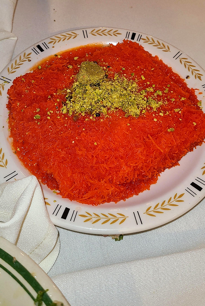 Kunafa glows like a desert sunset, its shredded phyllo and sweet cheese core creating the Middle Eastern equivalent of comfort food's greatest hits album.