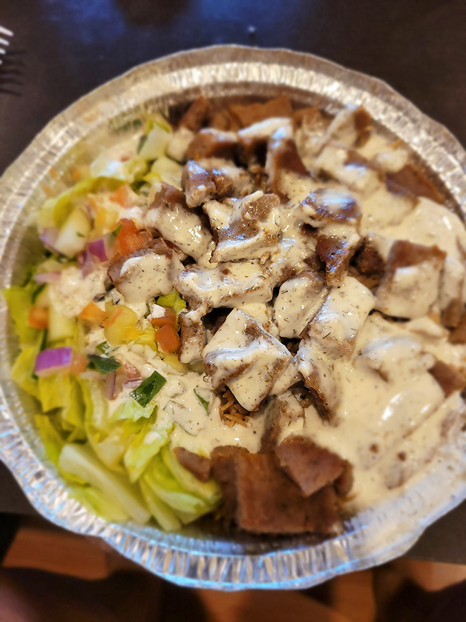 Tender chunks of lamb nestled on a bed of rice with fresh veggies&mdash;proof that Legends isn't just a one-trick chicken pony. 