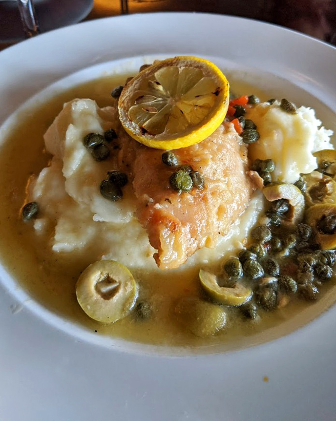 Lemon chicken swimming in buttery caper sauce transforms simple ingredients into something absolutely transcendent and memorable.