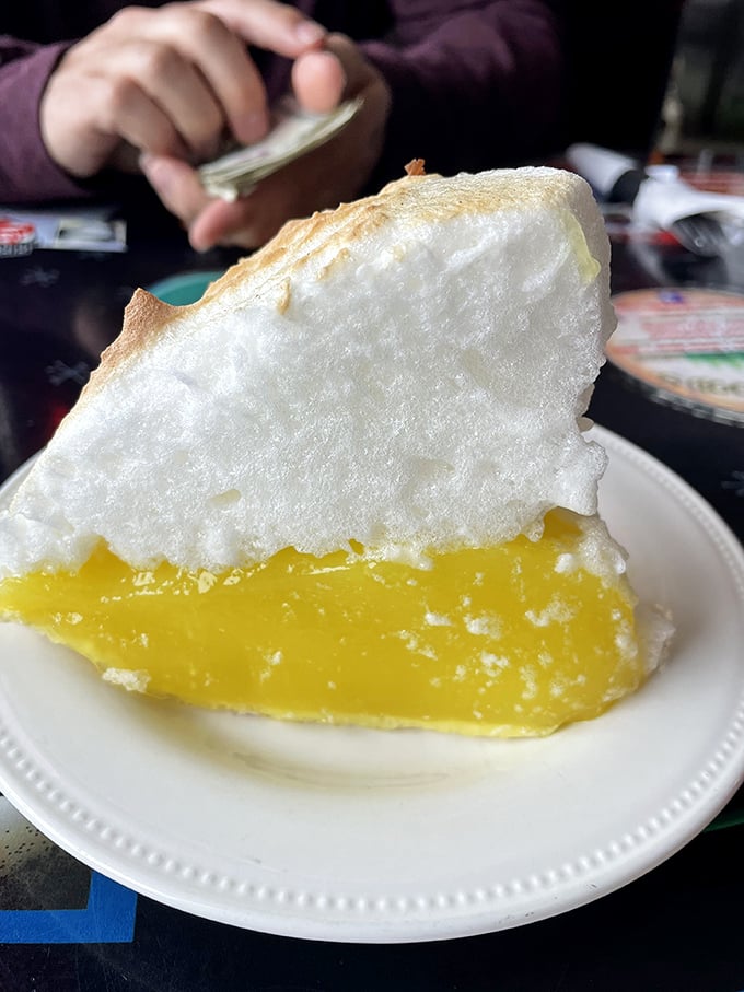 The lemon meringue pie defies gravity with clouds of meringue floating above sunshine-yellow filling. Worth every calorie and then some.