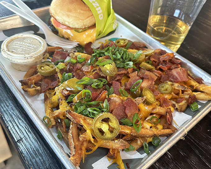 Loaded fries that require a game plan. The jalape&ntilde;os, bacon, and scallions create a flavor symphony that Mozart would have appreciated.