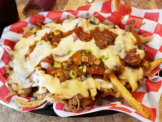 Loaded fries that blur the line between side dish and main event. A mountain of pulled pork, cheese, and green onions that demands to be shared&mdash;or not.