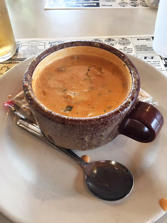 This isn't just soup; it's a maritime treasure hunt in a mug, with each spoonful revealing chunks of lobster swimming in creamy, herb-flecked broth.