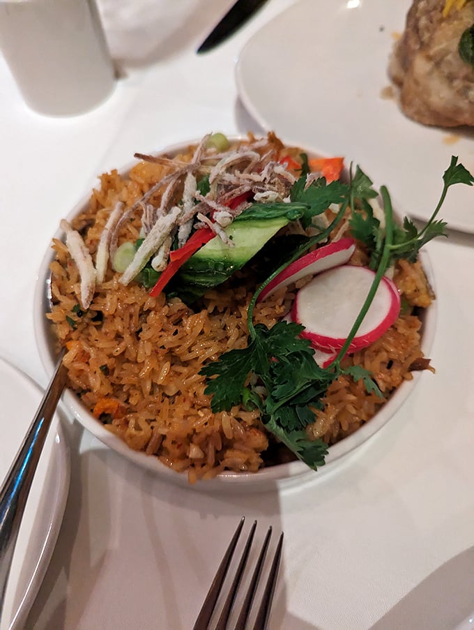 This isn't just fried rice&mdash;it's a colorful celebration where lobster decided to crash the party and everyone's delighted by the surprise guest.